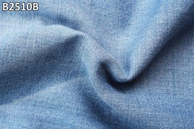 China Shirt Denim Fabric 5oz Soft Hand Feel Good Quality Rigid 100% Cotton for sale