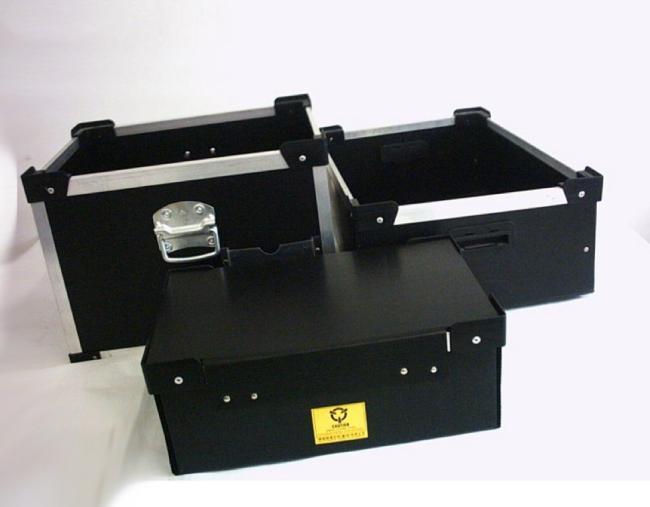 Stacked plastic corrugated storage bins in warehouse setting