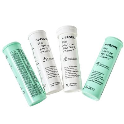 China Tubos de comprimidos efervescentes de PP branco com rolha de dessicante para embalagens de pílulas de vitaminas à venda