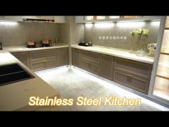 modern grey brass - trimmed kitchen cabinets - island - glass storage
