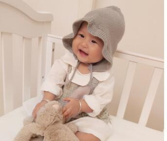China New autumn and winter tie light body knit hat children hat baby ear warm hat wholesale for sale