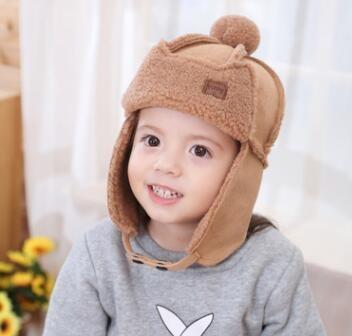 China Children Lei Feng hat Korean version of the baby fall and winter hats and velvet padded earmuffs cute fur ball warm baby for sale