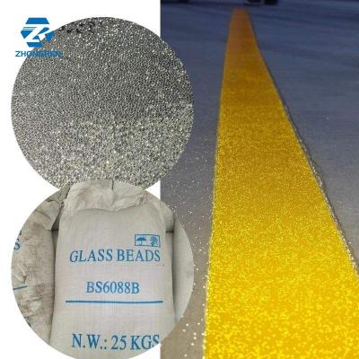 China EN1423 and EN1424 compliant road glass beads with high refractive index (Nd≥1.5) for improved wet night visibility in traffic lines for sale
