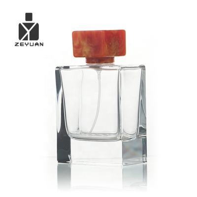 China Factory price 100ml square luxury atomizer spray luxury glass polished perfume bottle with resin cap for sale