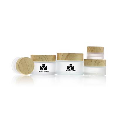 China Luxury Classic 30g Wooden Empty Wine Grain Covered Face Cream Eye Cream Frosted Glass Bottle for sale