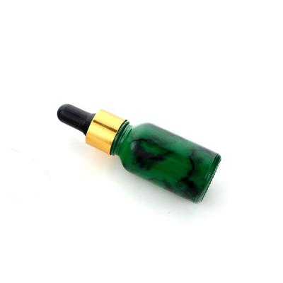 China Personal Care 15ml 30ml Green Essential Oil Glass Bottles Hair Marbling Cosmetic Oil Bottles With Dropper Caps for sale