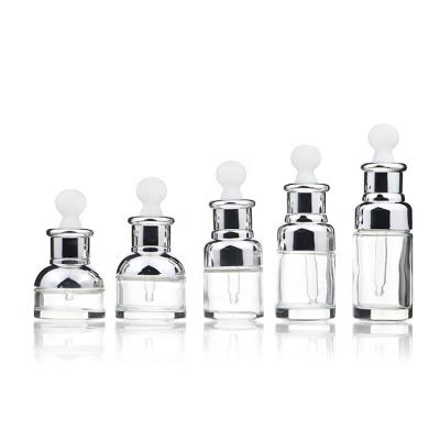 China Classic Luxury Push Button Dropper Bottles 20ml 30ml 40ml Serum Essential Oil Glass Bottle With Packaging for sale