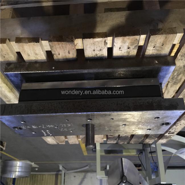 Detailed view of radiator header plate die components