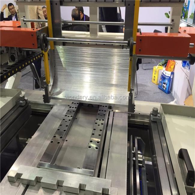 Condenser making machine in operation