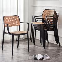 China Modern Stackable Plastic Dining Chair Rattan Design Armrest for sale