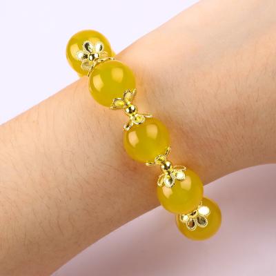 Cina 14MM Energia naturale Calcedonia gialla con cuore di giada gialla intagliato Braccialetto di perline di cristallo fortunato in vendita