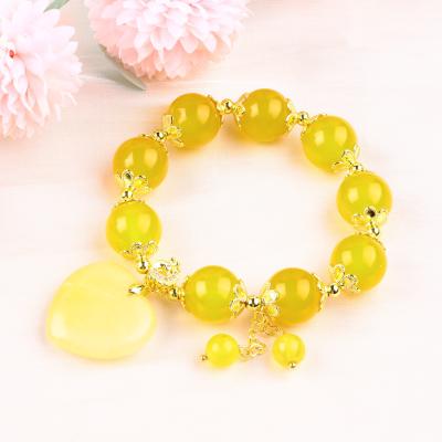 Cina 14MM Energia naturale Calcedonia gialla con cuore di giada gialla intagliato Braccialetto di perline di cristallo fortunato in vendita