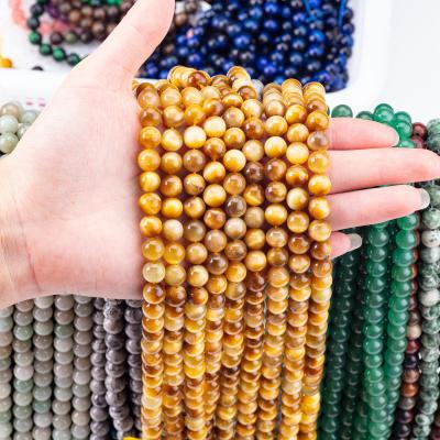 Cina 8mm Golden Tiger Eye Gemstone Beads Perle di cristallo per la produzione di gioielli in vendita