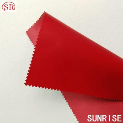 China High Quality Bright Red Smooth Soft Pu Synthetic Decorative Glitter Printed Sheet Leather Upholstery Fabric Jacket in Stock for sale