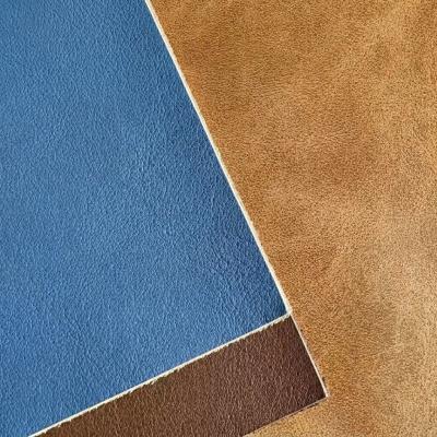 China Printed PU Thermo Leather with Nonwoven Backing Heat-Activated Color Change 0.6-0.7mm Thick for Notebook Bag Covers for sale