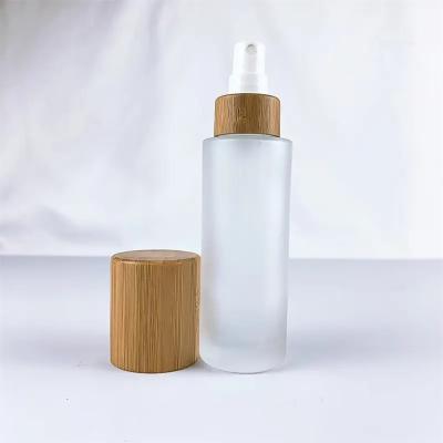 Cina Glass Shampoo Cosmetic spray Pump Bottle With Bamboo Cap in vendita