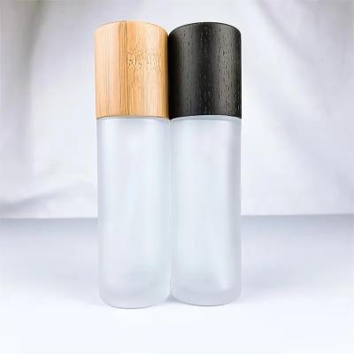 Cina Glass Shampoo Cosmetic spray Pump Bottle With Bamboo Cap in vendita