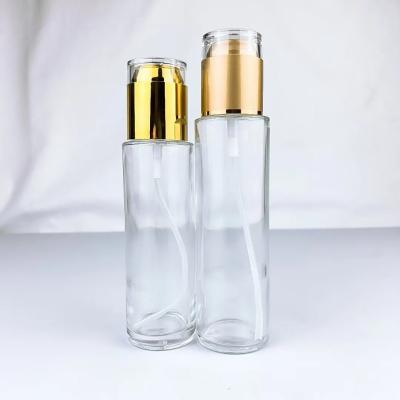 Cina round empty glass cosmetic liquid foundation serum lotion bottle with pump in vendita