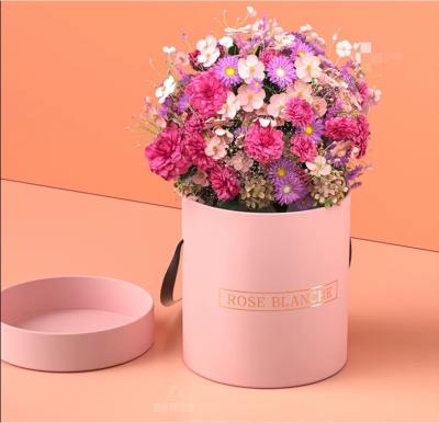 China Custom Luxury Round Flower Packaging Box Ribbon Handle Cylinder Rose Box for sale