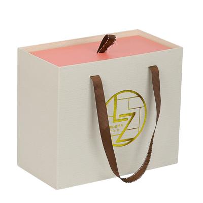 China Eco Friendly Rigid Cardboard Sliding Drawer Gift Boxes With Ribbon Handle for sale