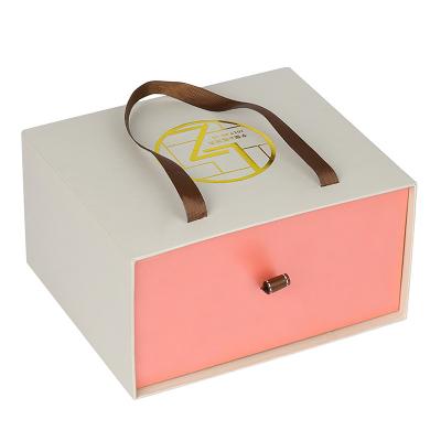 China Eco Friendly Rigid Cardboard Sliding Drawer Gift Boxes With Ribbon Handle for sale