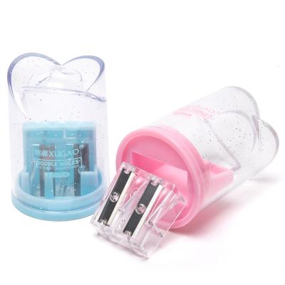 China 65Mn/PS patent transparent light pink pencil sharpener baby kid manual cute floral hole high quality plastic safe double flower material factory