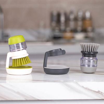 Cina Vendita calda di Amazon Pulizia della cucina Spazzola per il palmo della cucina Lavaggio delle stoviglie per pentole Aggiunta dell'erogazione automatica di sapone liquido per pentole in vendita