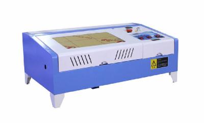 China High Grade Ht Motherboard DSP Cotnrol Repeatability0.01mm Honeycomb Working Table 3020 40/50W CO2 Laser Engraving Machin for sale