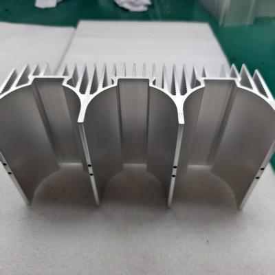 China Triple Arc Cavity Serrated Dense Fin Extruded Aluminum Heat Sink For Inverter Cooling for sale