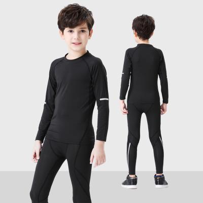 Cina Le calzamaglia dei bambini che preparano i vestiti bassi di forma fisica della manica delle ragazze dei ragazzi del pullover di autunno di inverno di pallacanestro di calcio di sport lunghi dell'uniforme in vendita