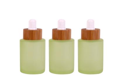 Cina bottiglia liquida dell'essenza 2oz con la bottiglia di vetro del contagoccia del coperchio di bambù per l'imballaggio cosmetico in vendita