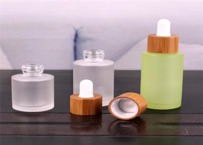 Cina bottiglia liquida dell'essenza 2oz con la bottiglia di vetro del contagoccia del coperchio di bambù per l'imballaggio cosmetico in vendita