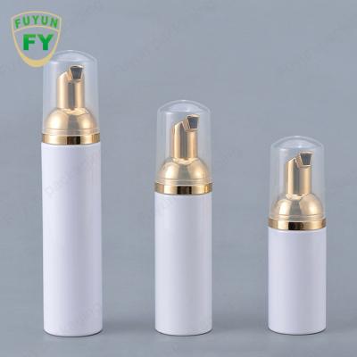 Cina bottiglia della pompa della schiuma dell'oro di 30ml 50ml 80ml con il chiaro cappuccio in vendita
