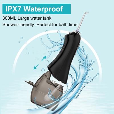 China 2500mAh Battery Water Flosser 5 nozzles Portable Rechargeable Teeth Whitening Electric Oral Irrigator for sale