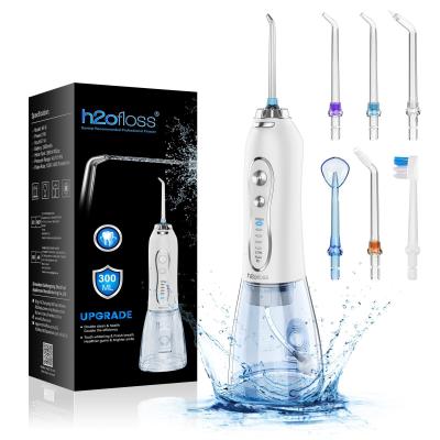 China High Quality Oral Irrigator Portable and Travel Teeth Care Dental Flosser With Wireless Charging Water Flosser for sale