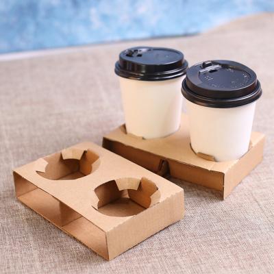 Cina Disposable Cup Holder for Hot or Cold Drinks 2cups 4 Cups Drink Carrier with Handle Kraft Paperboard Coffee Cup Holder in vendita