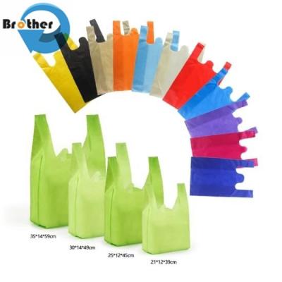 Cina Cheap Eco-Friendly Reusable W Cut T Shirt Vest PP Non Woven Supermarket Tote Grocery Shopping Carry Gift Bag for Sale in vendita