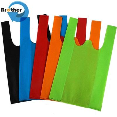 Cina Promotional PP Non Woven TNT Bags/Polypropylene Nonwoven T Shirt Bags Bag/W-Cut Non-Woven Vest Carrier Shopping Bag in vendita