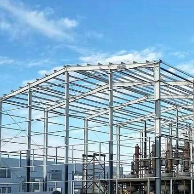 China Prefab Warehouse Building With EPS Sandwich Wall Cladding Round Steel Bat Bracing And Sandwich Panel Roofing for sale
