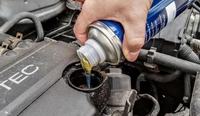 Engine oil additive application in vehicle maintenance