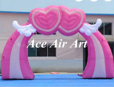 China custom pink inflatable event arch with flying heart for wedding decoration for sale