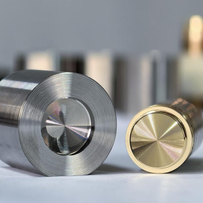 Custom injection molded round knobs with CD pattern details