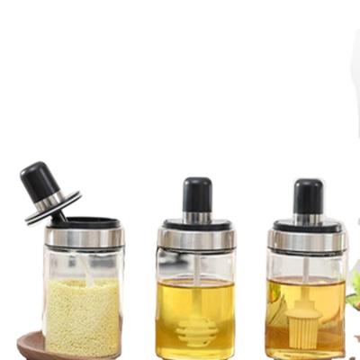 China Kitchen spice jars spoon unique round brush lid seasoning honey glass storage bottle for sale