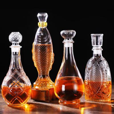China Amazon hot selling wholesale clear luxury whiskey unique shaped glass wine bottles for sale