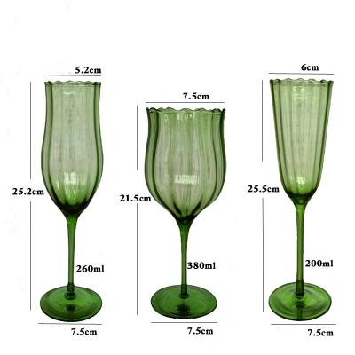 China Vintage elegant flower shape wave pattern green unbleached goblet champagne glass for sale
