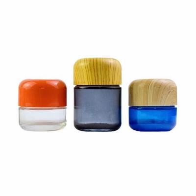 China Customized factory straigh With safety design glass Child Safety Tamper Child protection jar Cap Cosmetic Eye cream bottle for sale