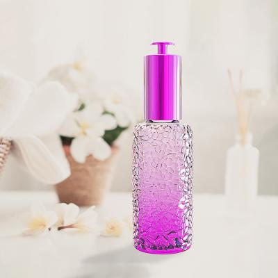 China JoeForG 60ml Round bottom seed pattern Cosmetic packaging bottle wholesale perfume glass bottle with lid for sale