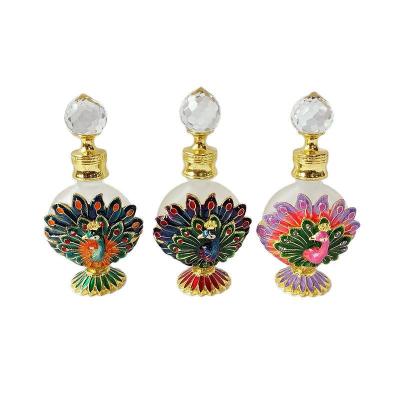 China Middle Eastern style Dubai peacock in separate bottles perfume essential oil empty glass bottle for sale