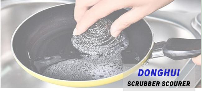Stainless steel cleaning ball effectively cleaning a pan surface