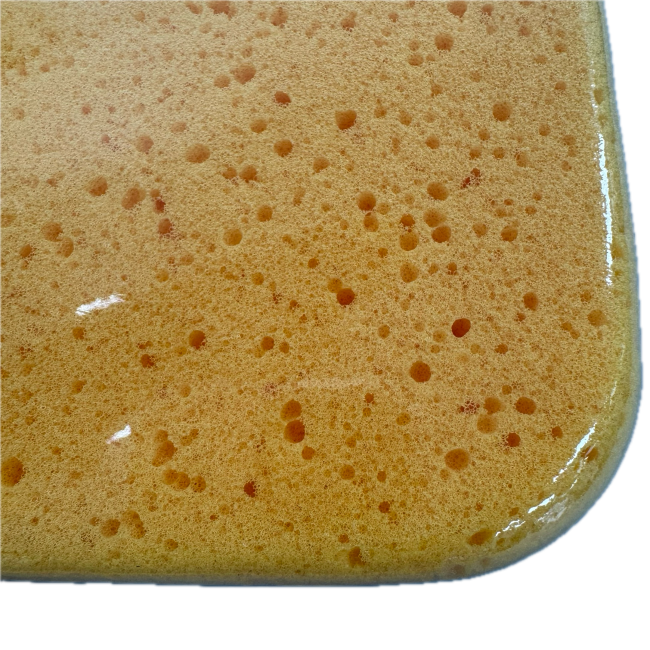 Epoxy grout cleaning sponge showing texture and shape